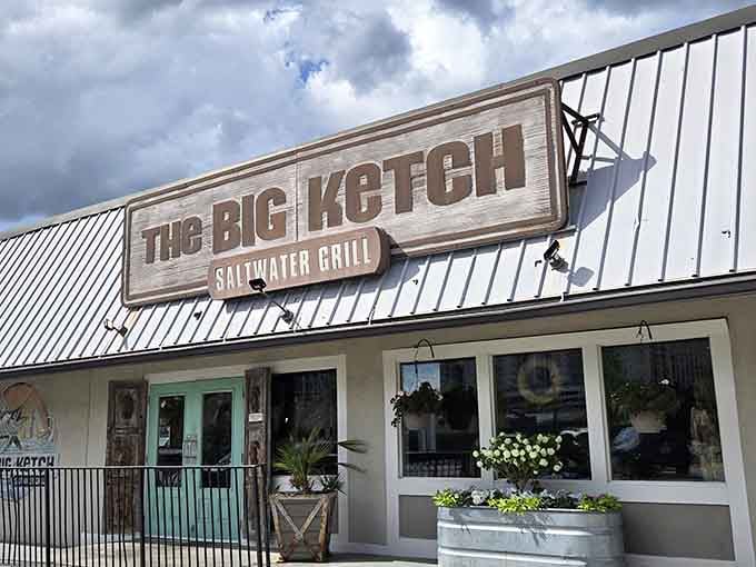 That weathered wood sign isn't just decoration, it's a promise of the coastal escape waiting inside.