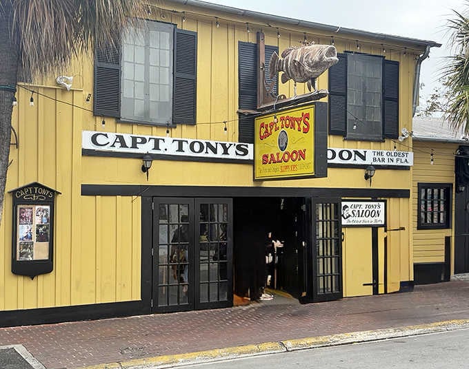 That bright yellow exterior isn't just a building, it's a beacon calling you to Florida's oldest watering hole.