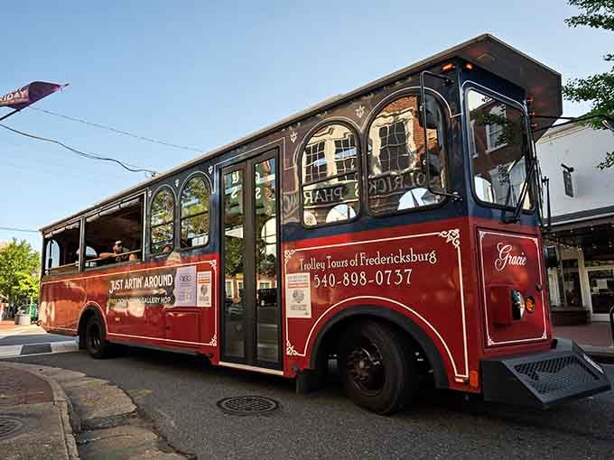 That gleaming red and white trolley isn't just transportation, it's your ticket to Virginia wine country without the designated driver guilt.