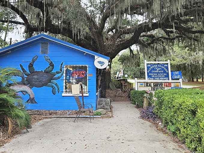 That blue building with the giant crab isn't just photogenic, it's your gateway to seafood heaven under the oaks.
