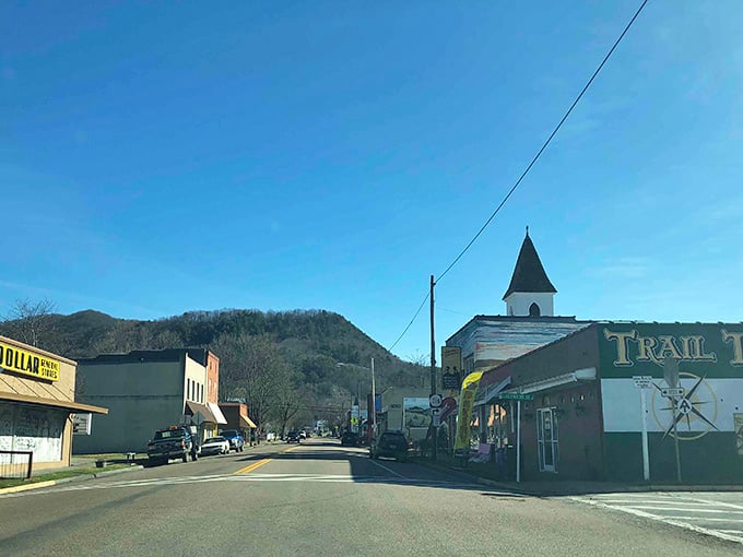 Main Street runs straight into the mountains here, where the church steeple points toward peaks that've seen centuries pass.