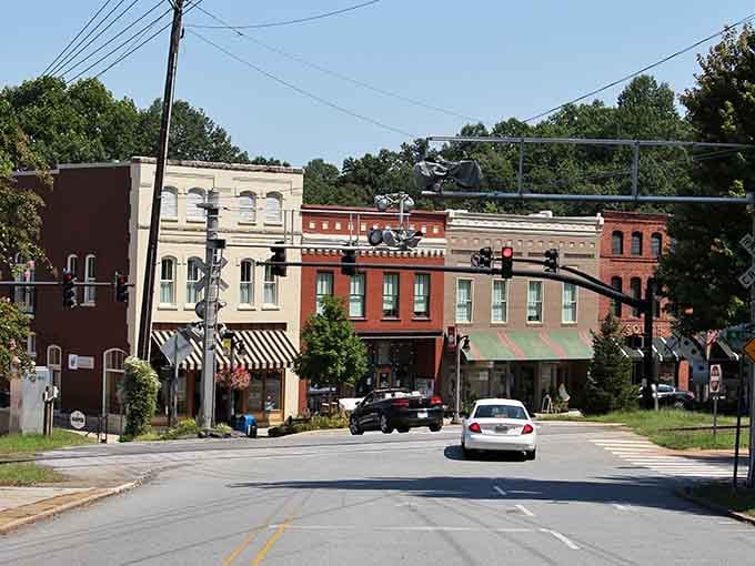 Those striped awnings aren't just charming, they're practically waving you inside to discover what treasures await downtown.