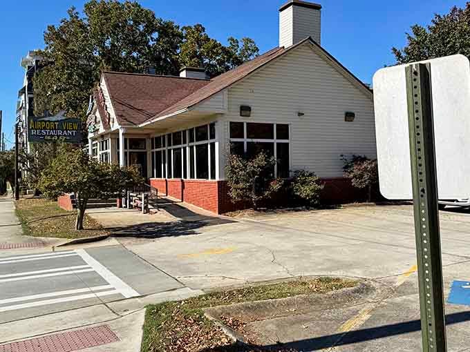 That unassuming white building holds more Southern comfort than your grandmother's hug and twice the flavor.