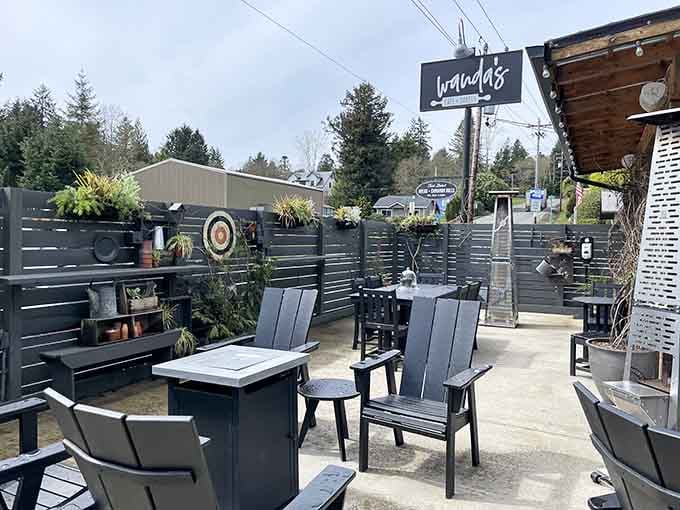 That charming sign and cozy patio setup practically beg you to pull over and stay awhile.