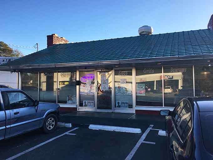 That classic diner storefront promises serious breakfast inside, and those window signs don't lie about what's cooking.