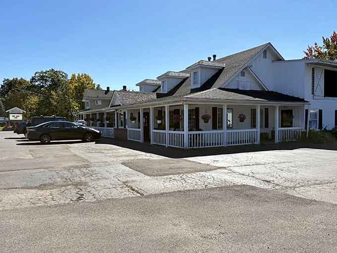 Classic white exterior with wraparound porch proves the best breakfast spots don't need flashy signs to draw crowds.
