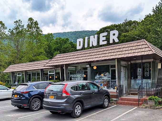 That classic rooftop sign against the Catskill Mountains makes you feel like you've discovered America's best-kept breakfast secret.