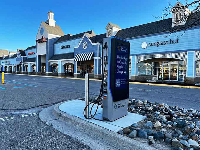 The charming blue facades and thoughtful landscaping prove that outlet shopping doesn't have to feel like a warehouse experience.