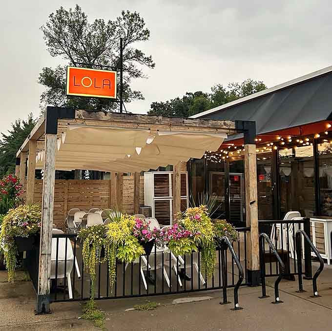 That bright orange sign isn't just decoration, it's a beacon calling pizza lovers home to happiness.