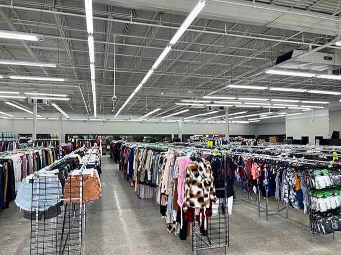 Rows of possibilities stretch endlessly under industrial lighting where bargain hunters find their happy place every single day.