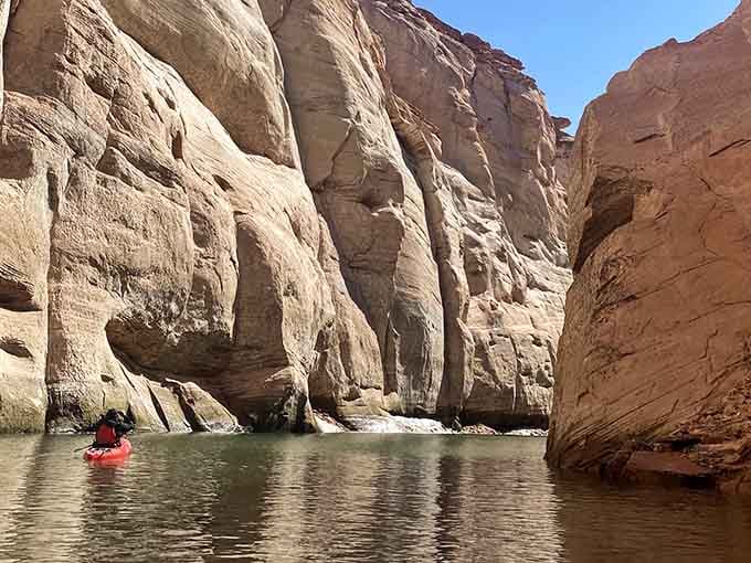 Towering canyon walls frame your path as you paddle into nature's own cathedral of stone.