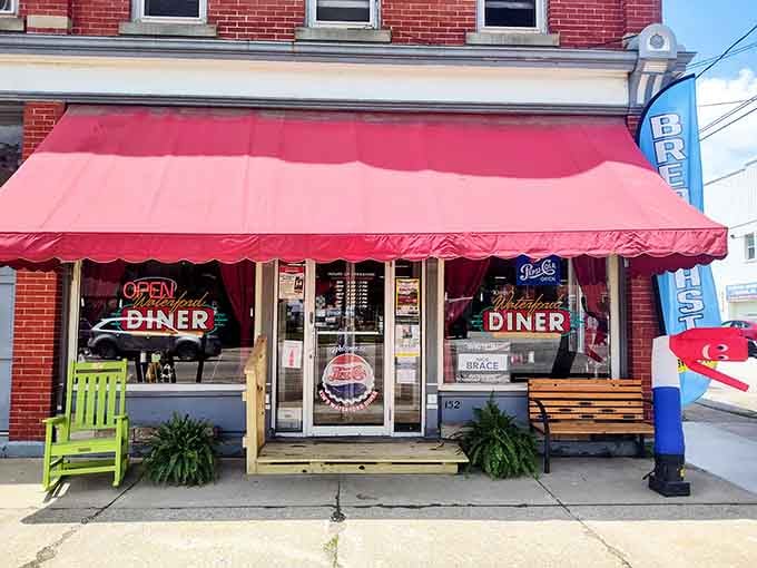That cheerful red awning and lime green porch furniture practically beg you to come inside for breakfast.