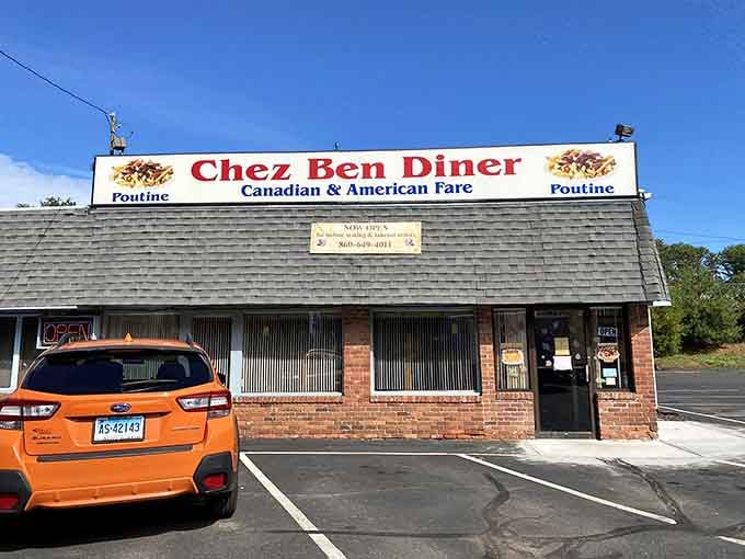Unassuming brick exterior hiding Canadian comfort food treasures, this is where real maple syrup flows freely every morning.