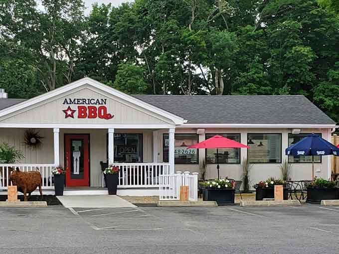 That charming cottage-style exterior with the red door is your gateway to barbecue heaven in Rowley.