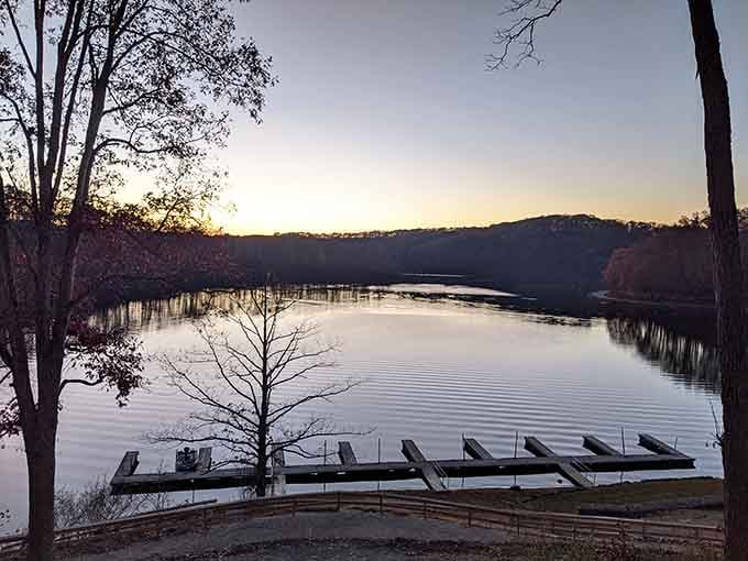 Dawn breaks over the lake like nature's own screensaver, complete with mist and docks waiting for adventure.