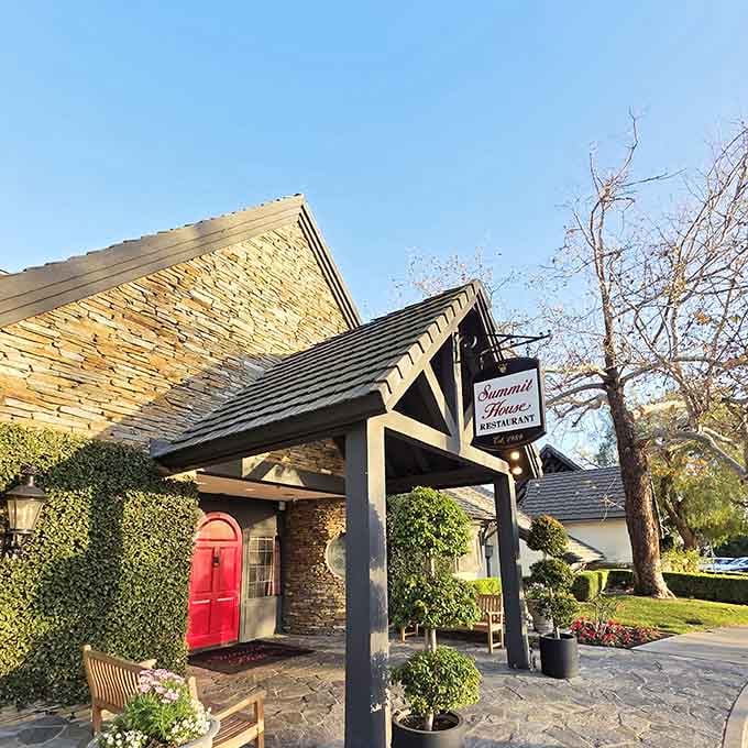 That red door and Tudor beams on a California hilltop prove that architectural rules are meant to be delightfully broken.