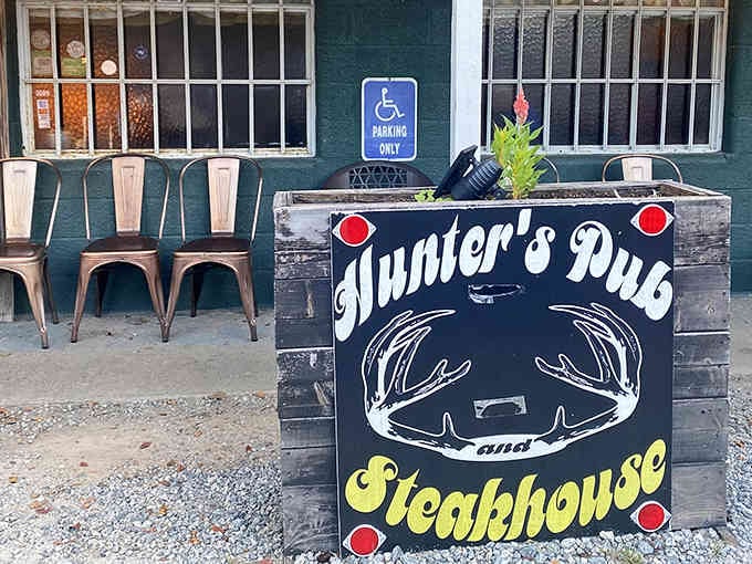 That hand-painted sign with the antler logo tells you everything you need to know about this place's personality.
