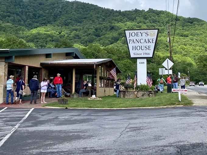 The mountains provide the backdrop, but that sign promises the real scenery is waiting inside on your plate.