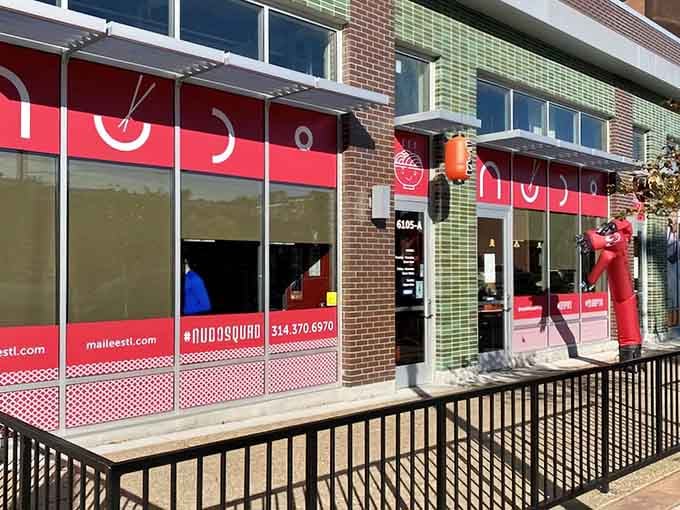 That bold red storefront isn't shy about announcing what's inside: serious noodle business awaits.