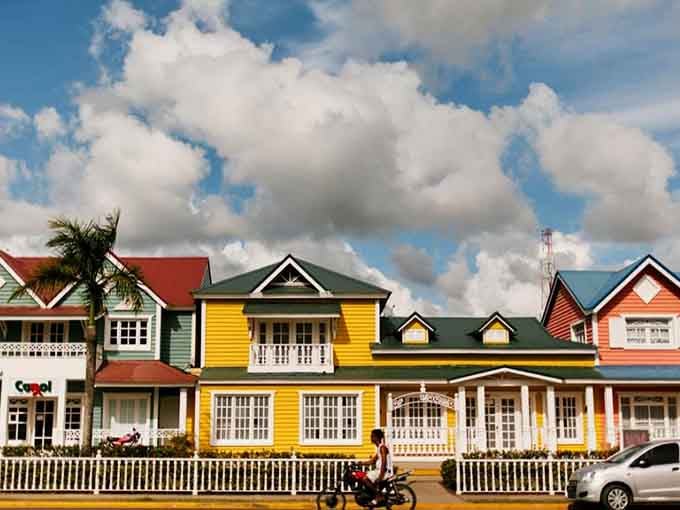 Small-town charm meets rainbow-bright architecture where every building tells its own colorful story beautifully.