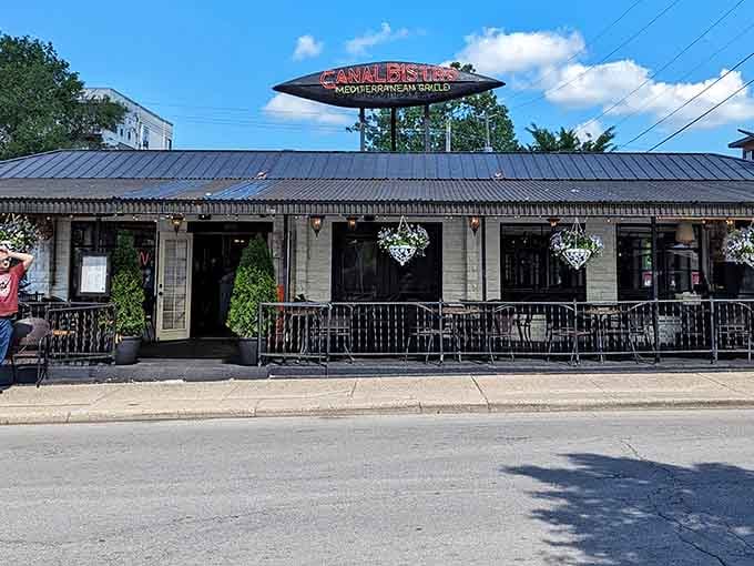 That distinctive sign beckons you to Mediterranean paradise, right here along Indianapolis's most scenic waterway.