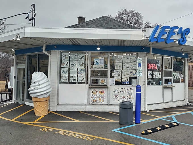 The giant cone sculpture stands guard like a delicious sentinel, promising creamy perfection to all who approach this temple.