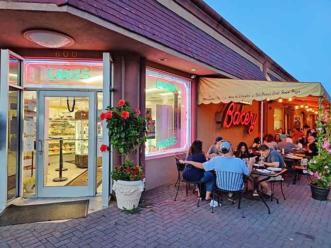 That neon glow and outdoor seating spell summer evenings where dessert becomes the main event, not the afterthought.