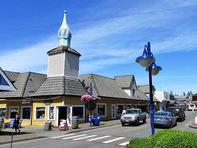 That white steeple rising above Scandinavian rooflines isn't a mirage, it's your gateway to Norwegian charm in Washington.