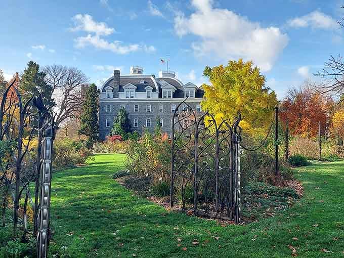 When historic stone buildings meet autumn gardens, you get views that belong on postcards, not reality.
