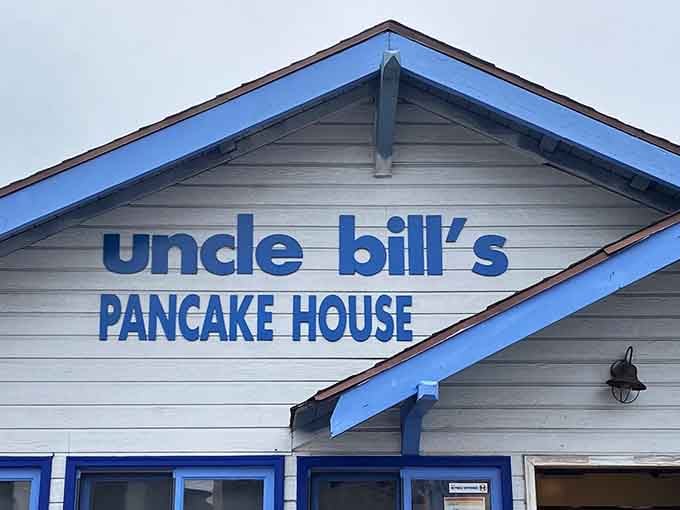 That blue and white sign isn't just directing you to breakfast, it's pointing the way to happiness in pancake form.