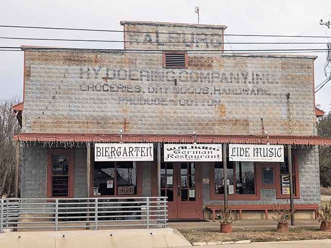 That faded ghost sign advertising groceries and dry goods tells you this building has stories to share.