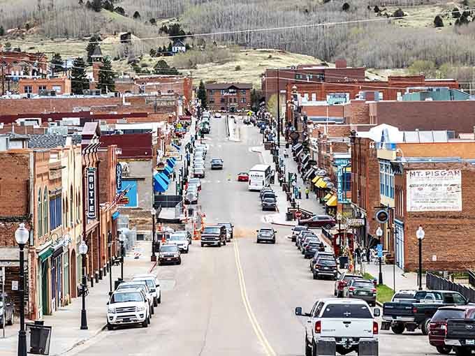 Bennett Avenue stretches before you like a time machine with a gambling problem and excellent mountain views.