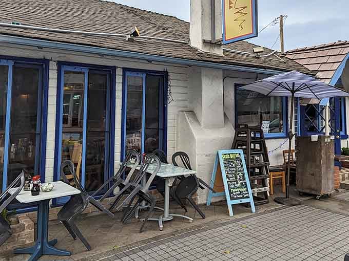 The blue trim and casual patio setup tell you everything you need to know: this is where beach town mornings begin properly.