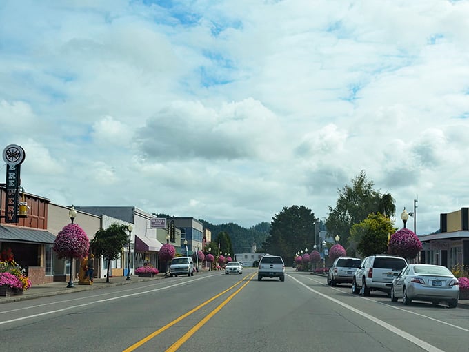 Main Street charm meets mountain backdrop where hanging flower baskets prove small towns still care about curb appeal.