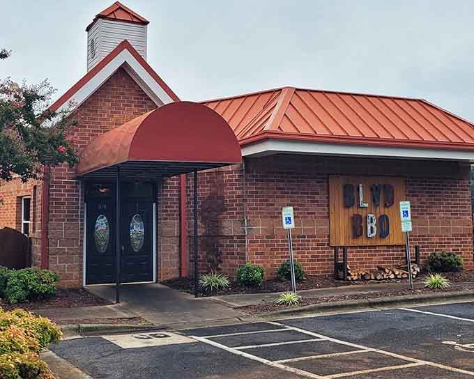 That copper awning and stacked firewood aren't just decoration &ndash; they're a promise of what's smoking inside.