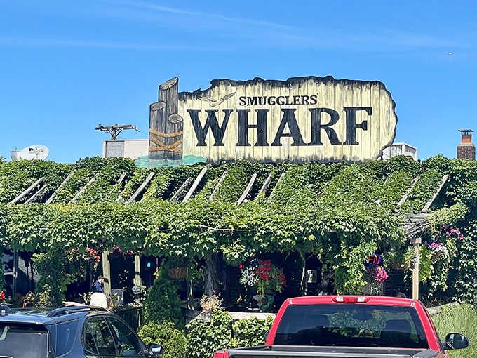 That iconic sign covered in vines isn't just marking a restaurant, it's announcing your arrival at seafood paradise.