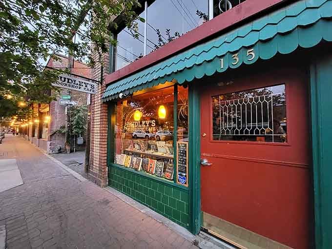 That turquoise awning and coral door combo proves some places understand color theory better than your average art museum.