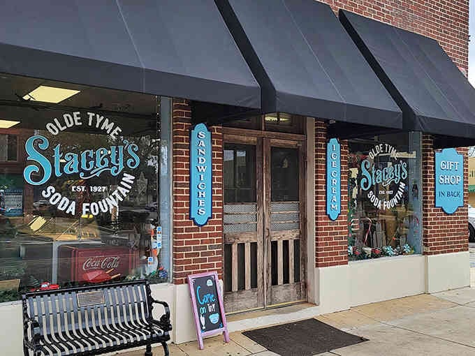 That brick facade with the black awnings is your portal to a sweeter, simpler time in Foley.