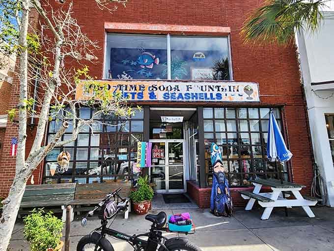 That brick facade and cheerful signage aren't just inviting you in, they're practically begging for a visit.