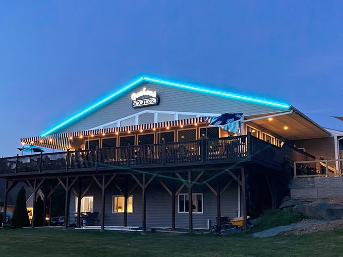 Lit up like a beacon for hungry travelers, Gresham's glows against the twilight sky promising steaks and lakeside magic.