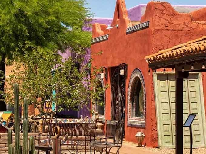 Adobe architecture meets patio dining where purple mountains frame every meal like a natural postcard.