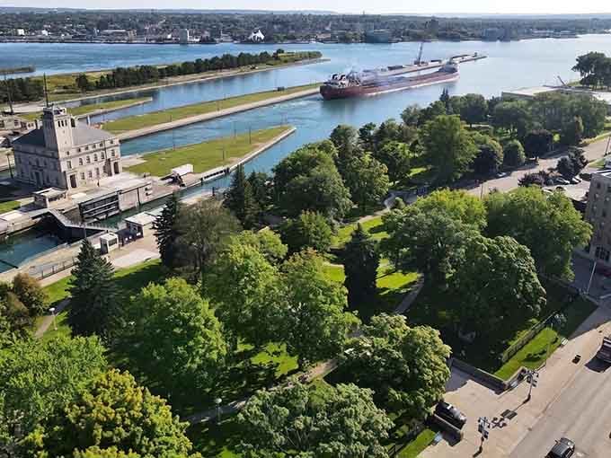 That's a freighter gliding through the Soo Locks like it's no big deal, just 1,000 feet of pure engineering magic.