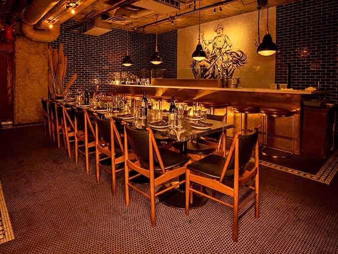 That communal table isn't just furniture, it's where strangers become friends over exceptional food and shared stories.