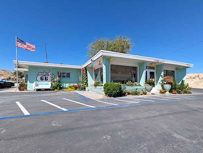 The turquoise exterior isn't just paint, it's a time machine that runs on nostalgia, burgers, and pure California sunshine.