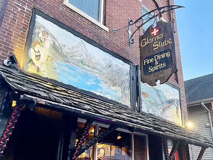 That hand-carved sign hanging above the entrance isn't just decoration; it's a promise of Alpine authenticity waiting inside.