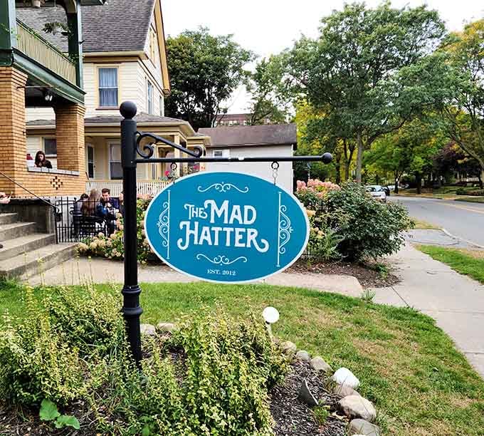 That turquoise sign beckons like a portal to another dimension, one where brunch is always served and whimsy reigns supreme.