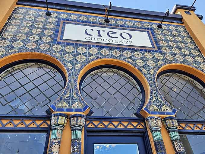 That stunning tilework isn't just decoration&mdash;it's your first hint that something extraordinary awaits inside this chocolate paradise.