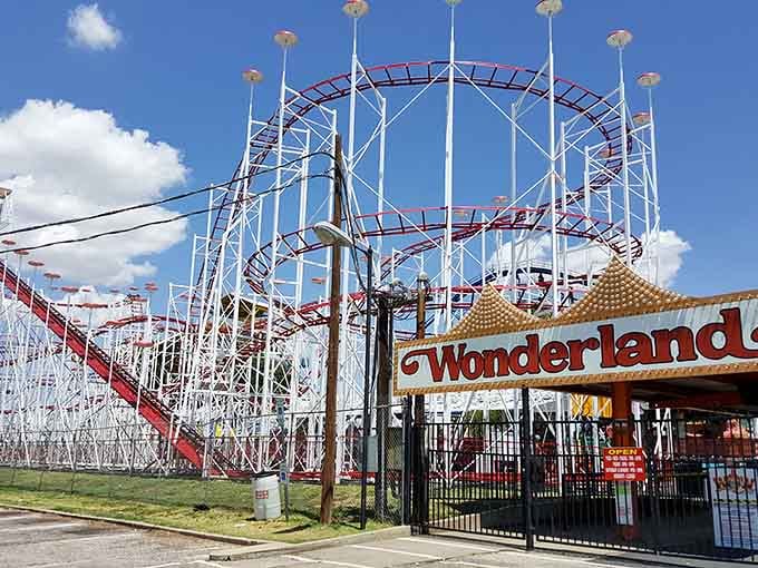 That classic wooden coaster framework against the big Texas sky is pure Americana on stilts.