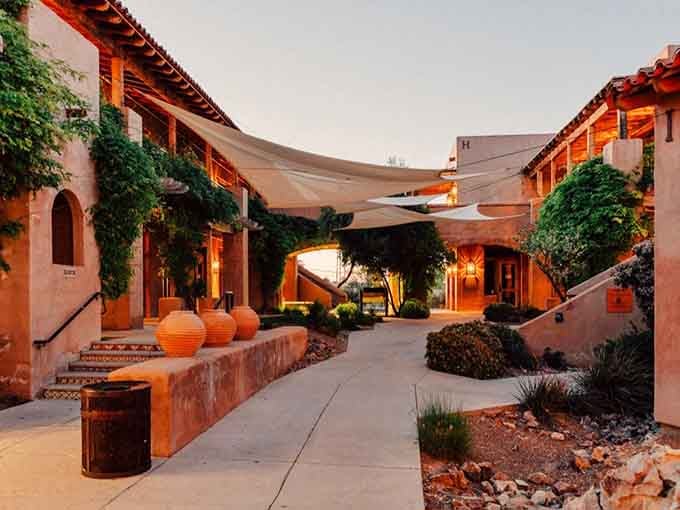 Adobe walls glow like sunset itself in this courtyard where Spanish colonial charm meets contemporary Southwest elegance.