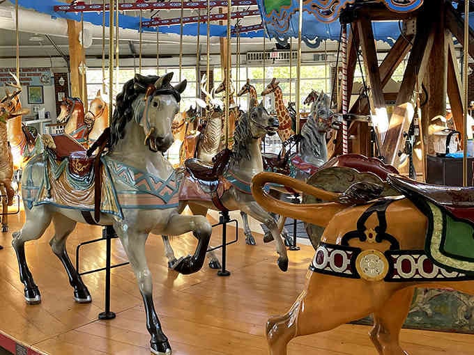Hand-carved wooden horses frozen mid-gallop, each one a masterpiece that puts modern assembly-line carousels to shame.